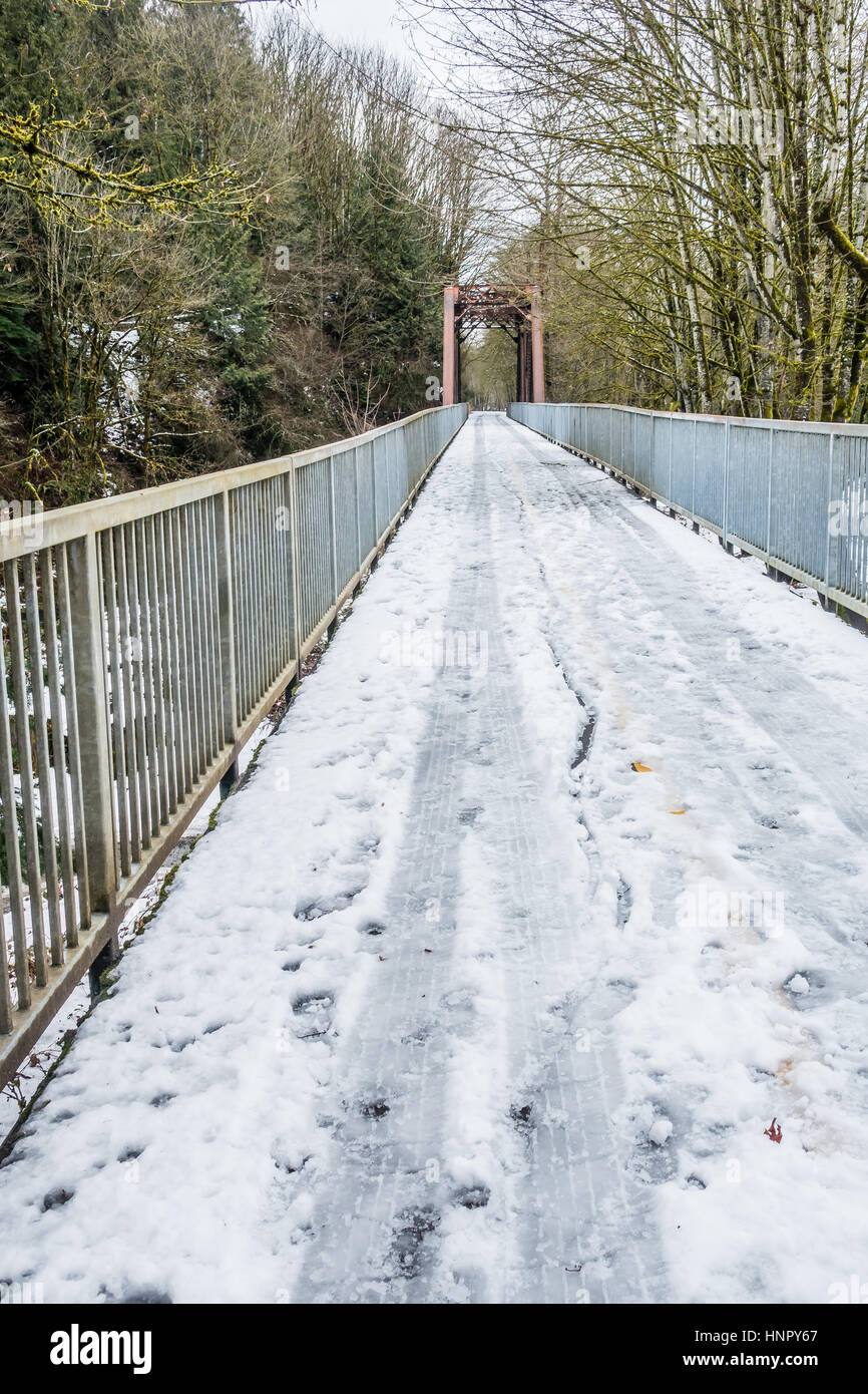 Snow covers a bridge and trestle that spans the Cedar River in Renton ...