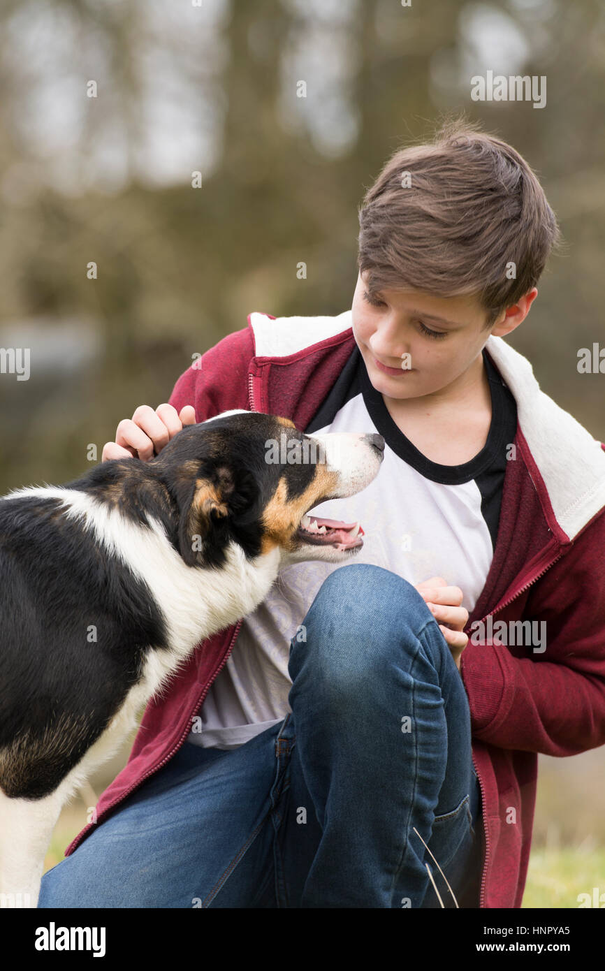 Teenager petting dog hi-res stock photography and images - Alamy