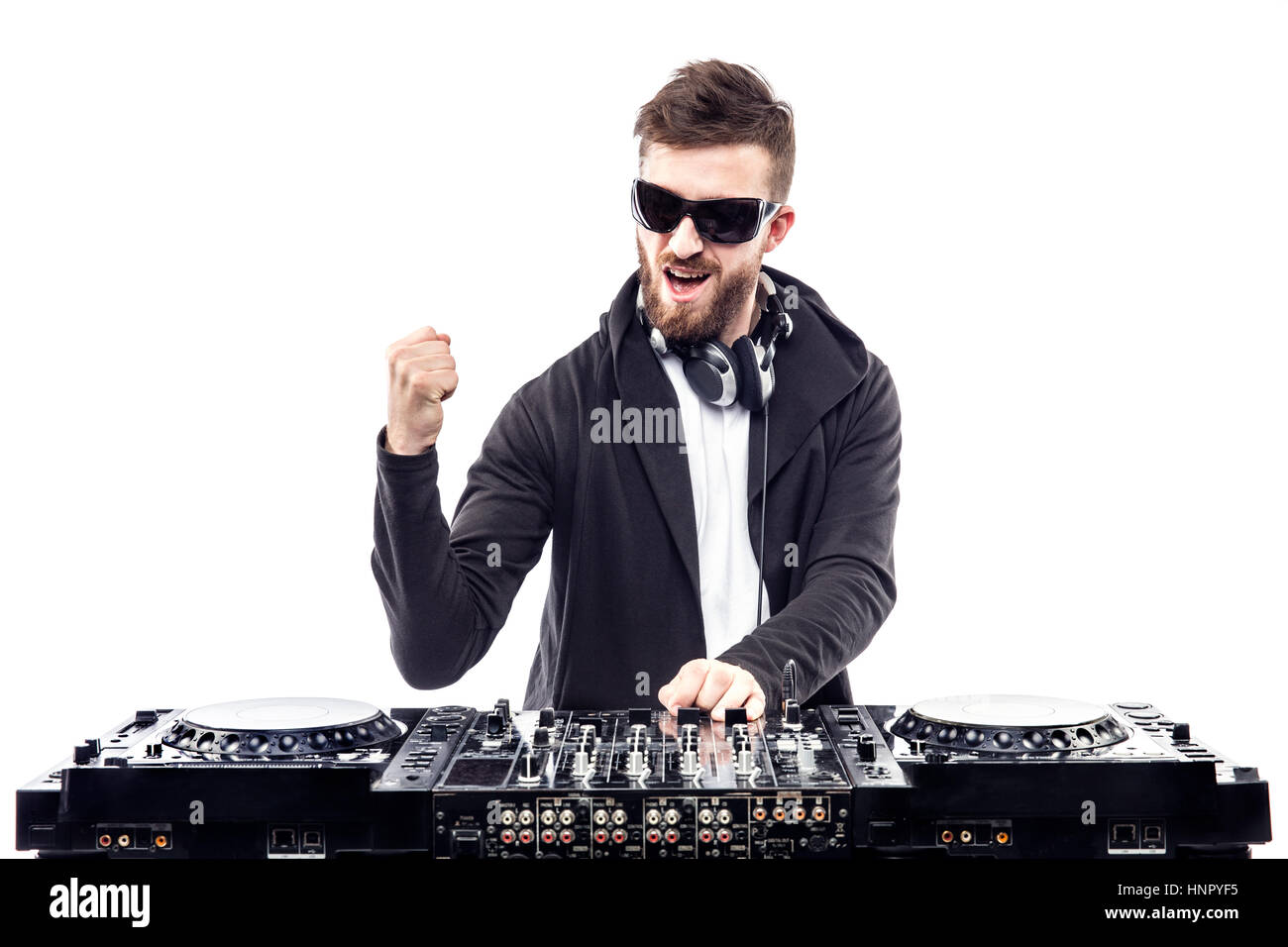 Trendy male dj posing against mixing console Stock Photo - Alamy