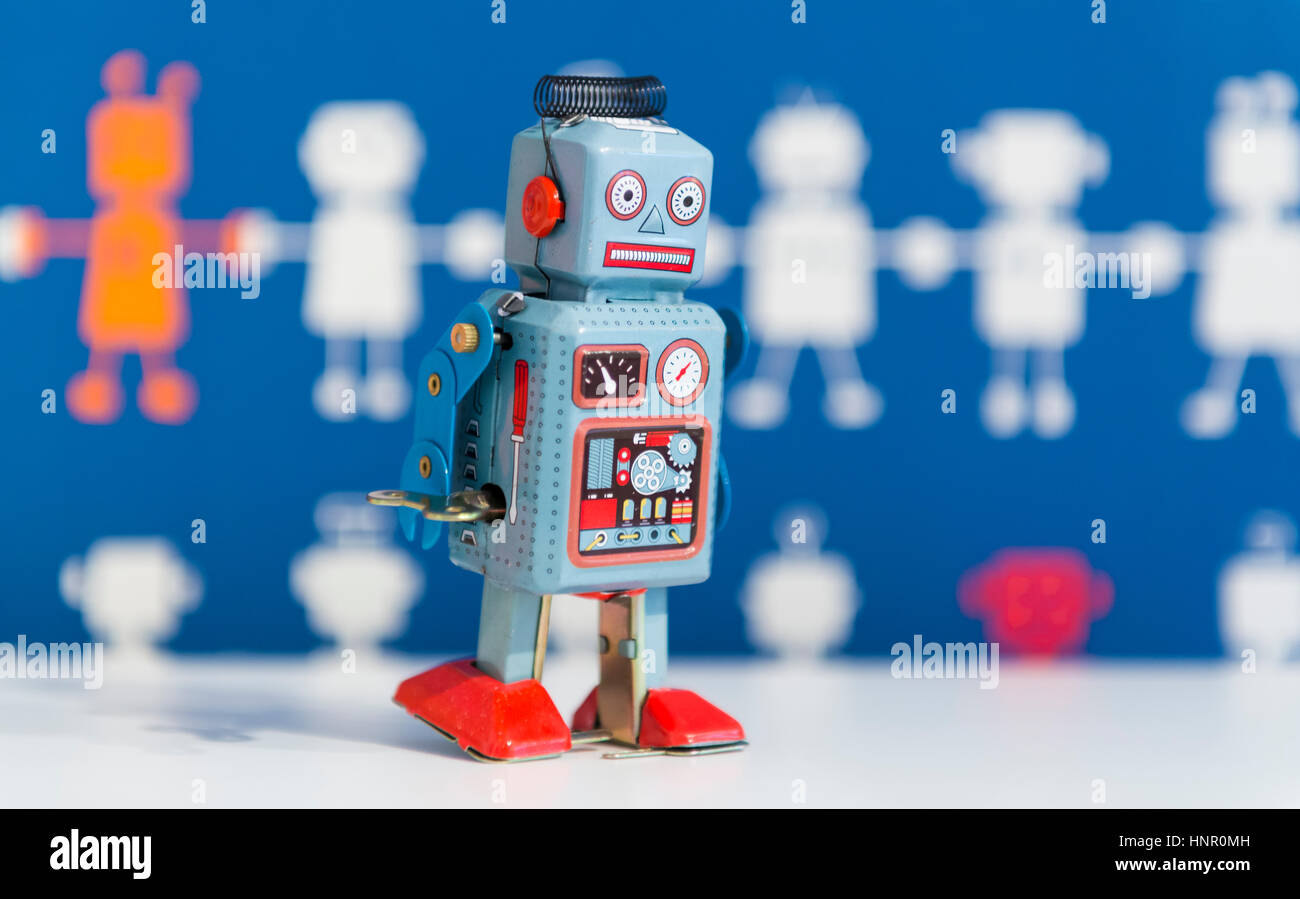 A vintage wind up toy robot, painted in blue and red Stock Photo - Alamy
