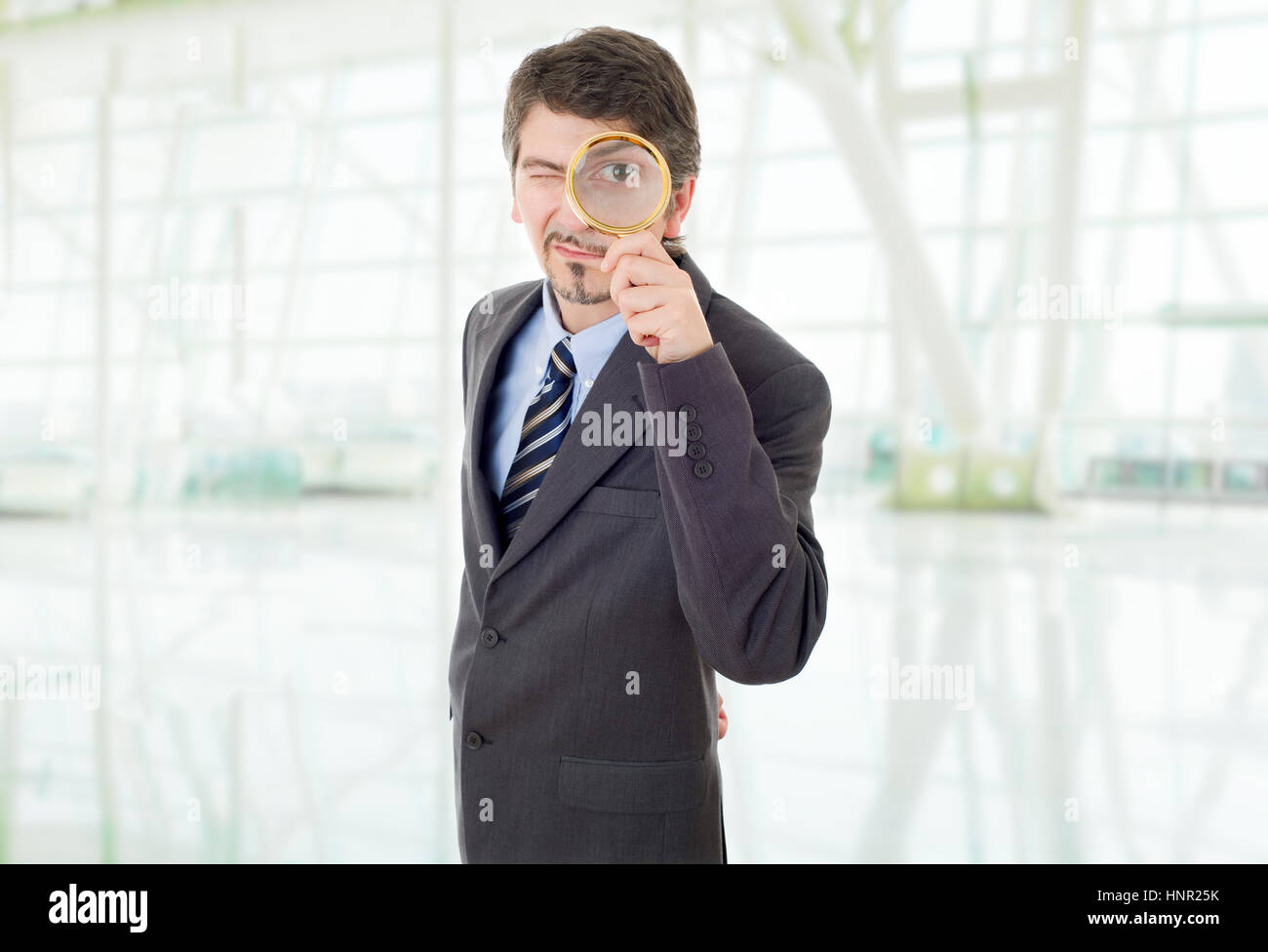 business man with magnifying glass at the office Stock Photo - Alamy
