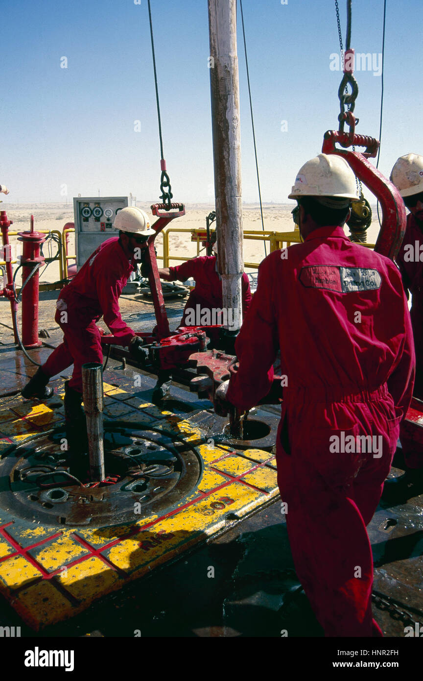 Drilling for oil in the Saudi desert near Abqaiq, by the Arabian ...