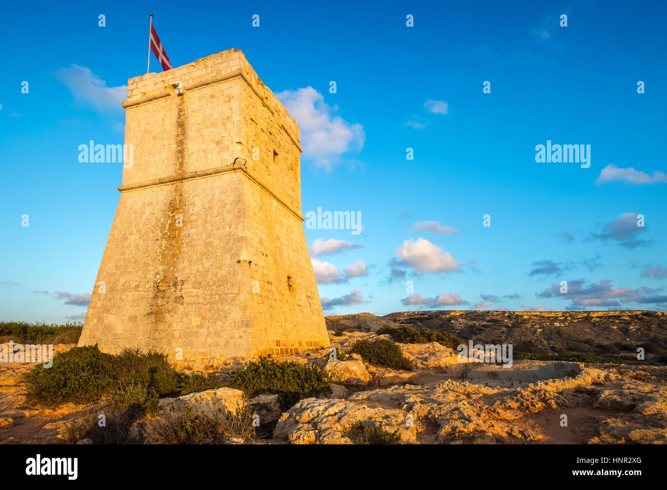 Malta - Ghajn Tuffieha watchtower at Golden Bay before sunset Stock ...