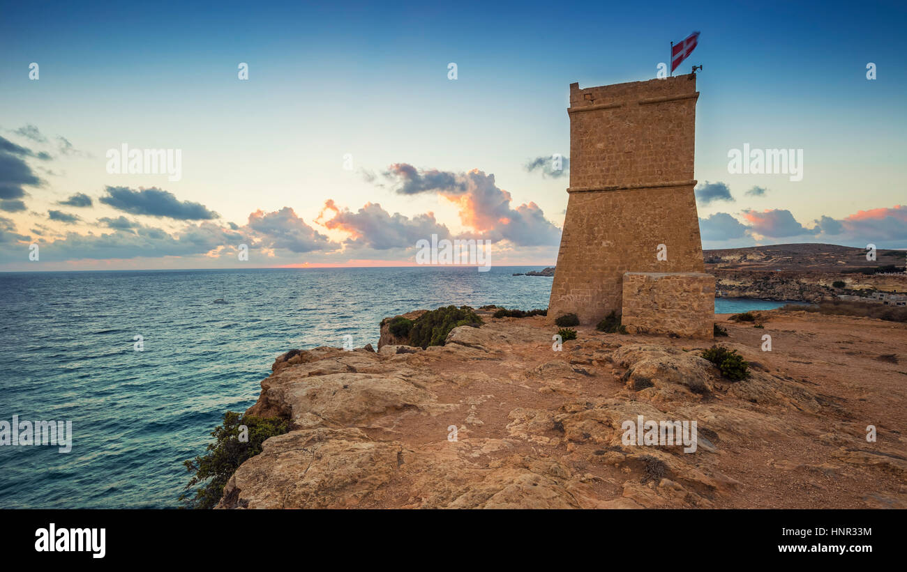 Malta - Ghajn Tuffieha watchtower at Golden Bay before sunset Stock ...
