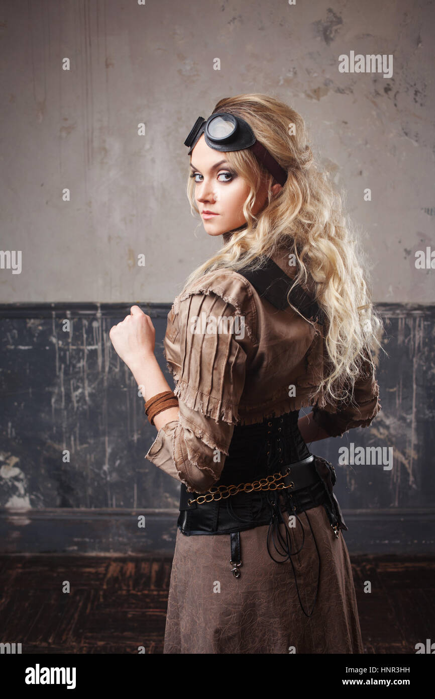 Portrait of a beautiful steampunk woman over grunge background Stock ...