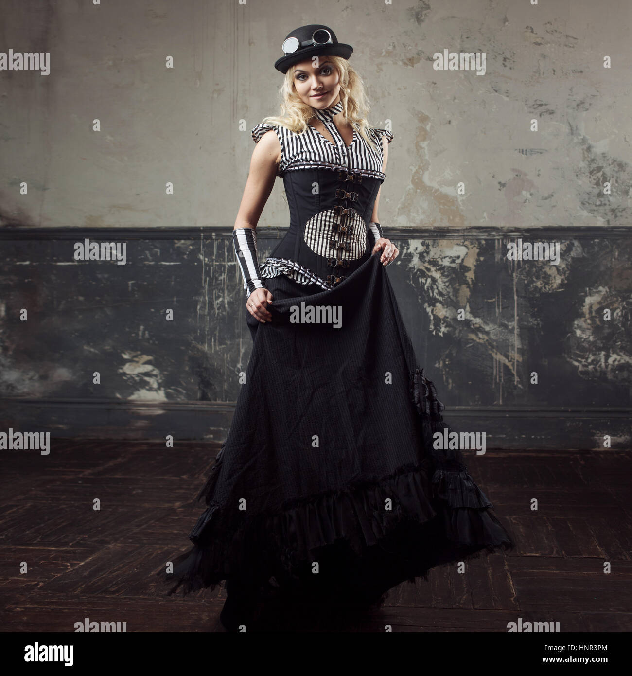 Portrait of a steampunk woman over grunge background. Beautiful lady in ...