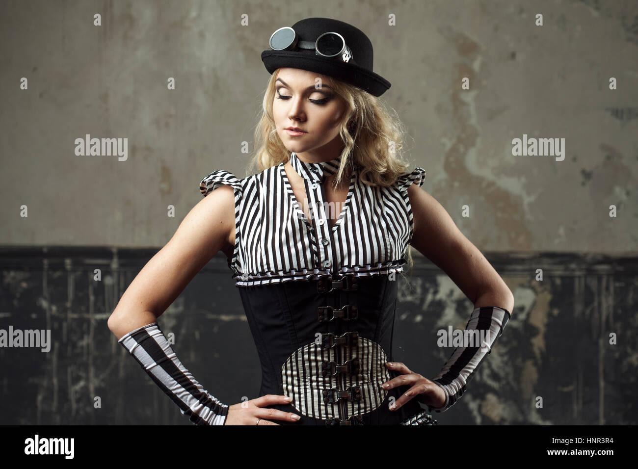 Portrait of a steampunk woman over grunge background. Beautiful lady in ...