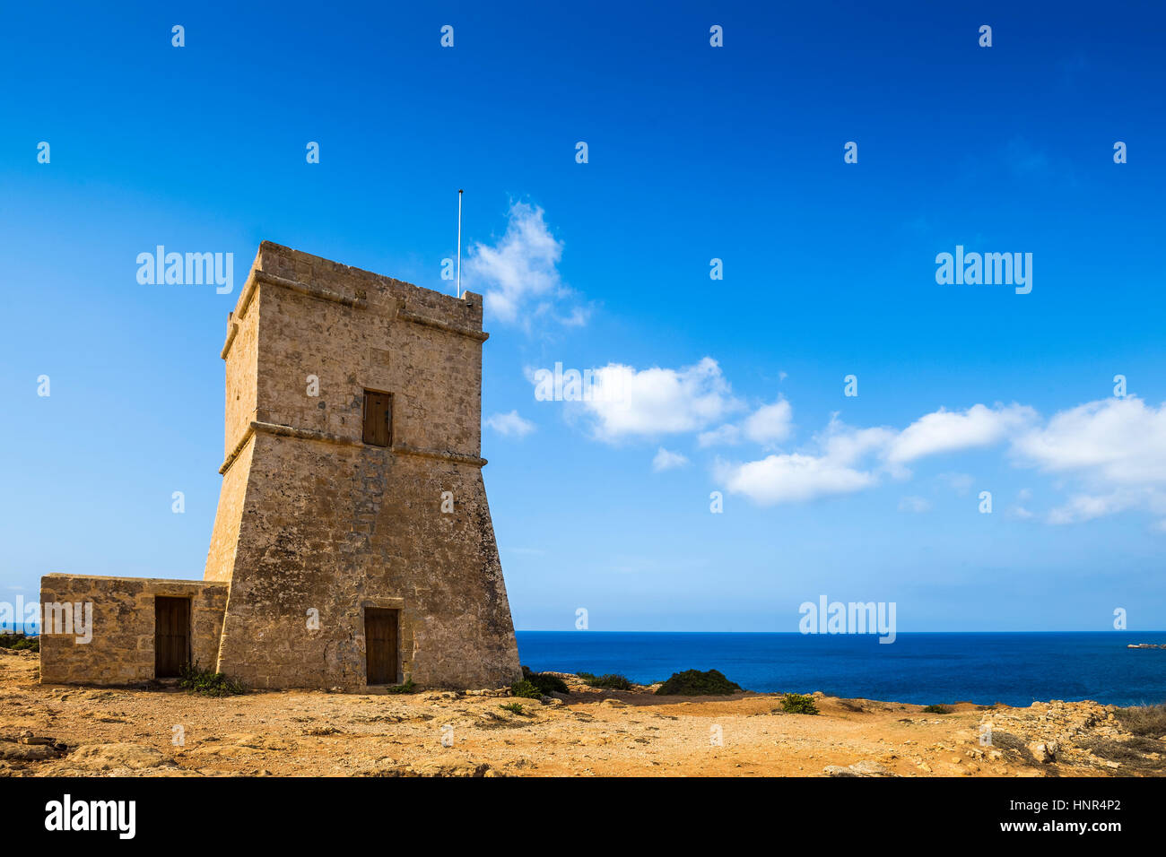 Malta - Ghajn Tuffieha watchtower at Golden Bay on a nice sunny summer ...