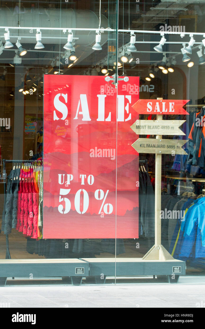 Sale signs in shop windows in city centre retail outlets Stock Photo ...