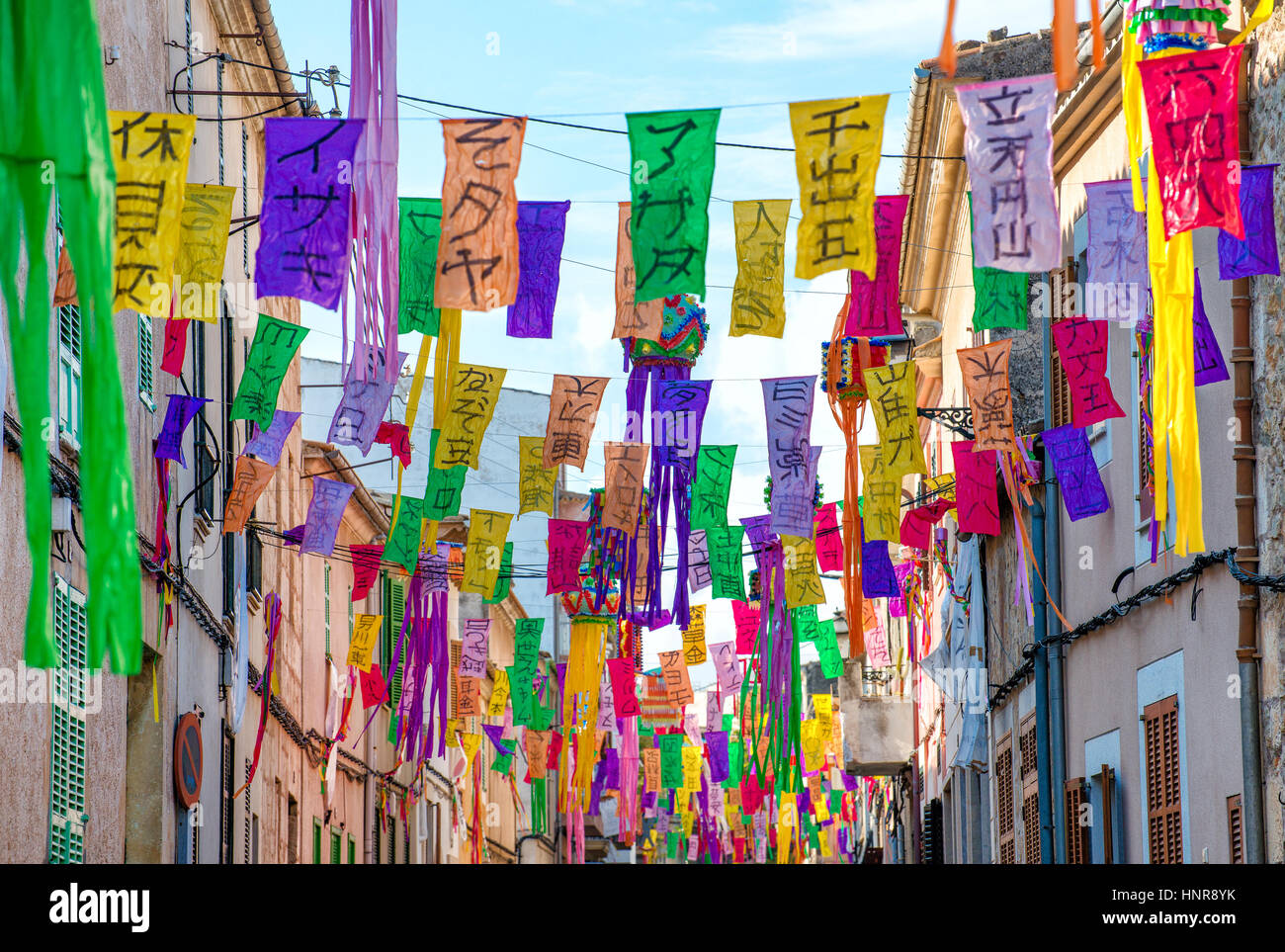 Street decorated with colorful signs Stock Photo - Alamy