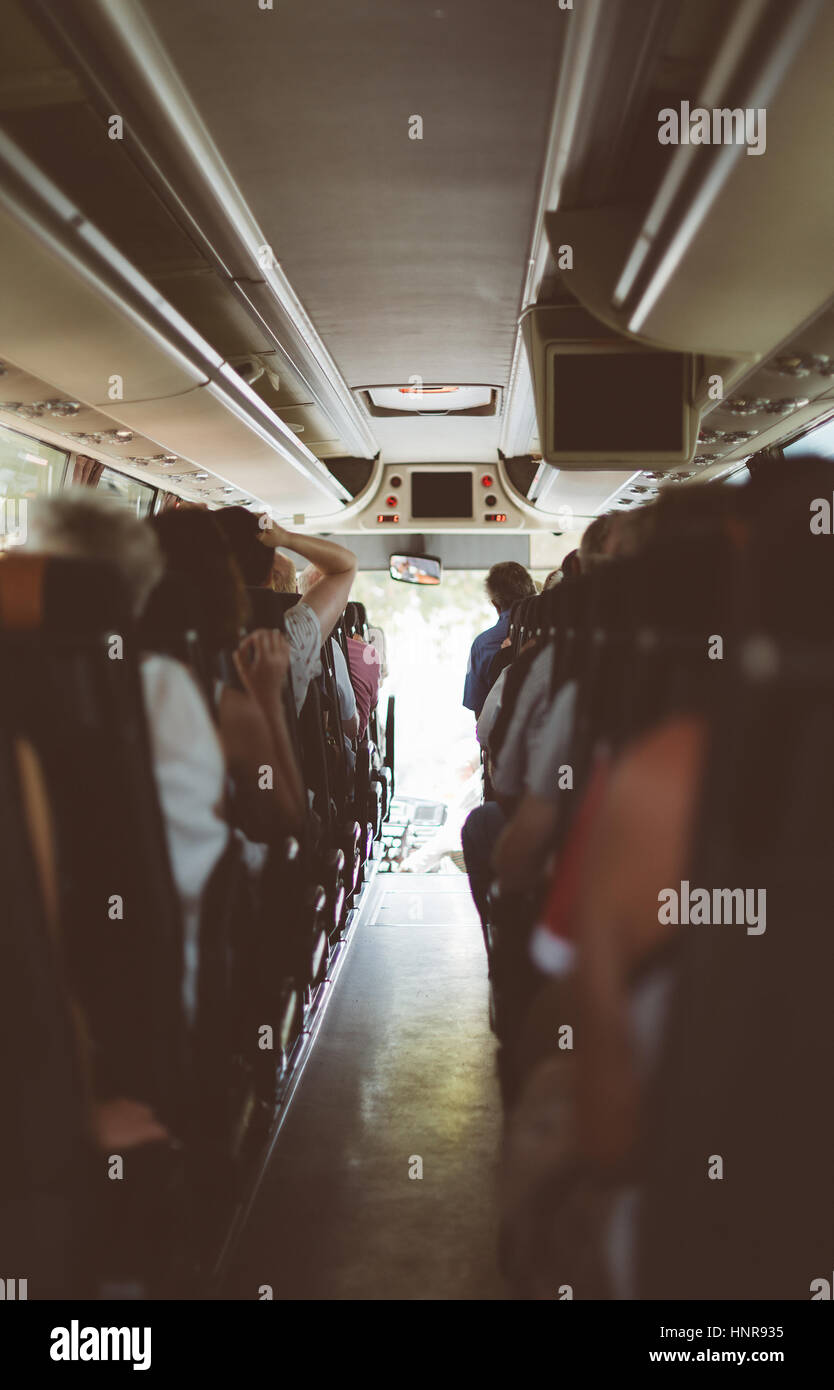 View from inside the bus with passengers Stock Photo - Alamy