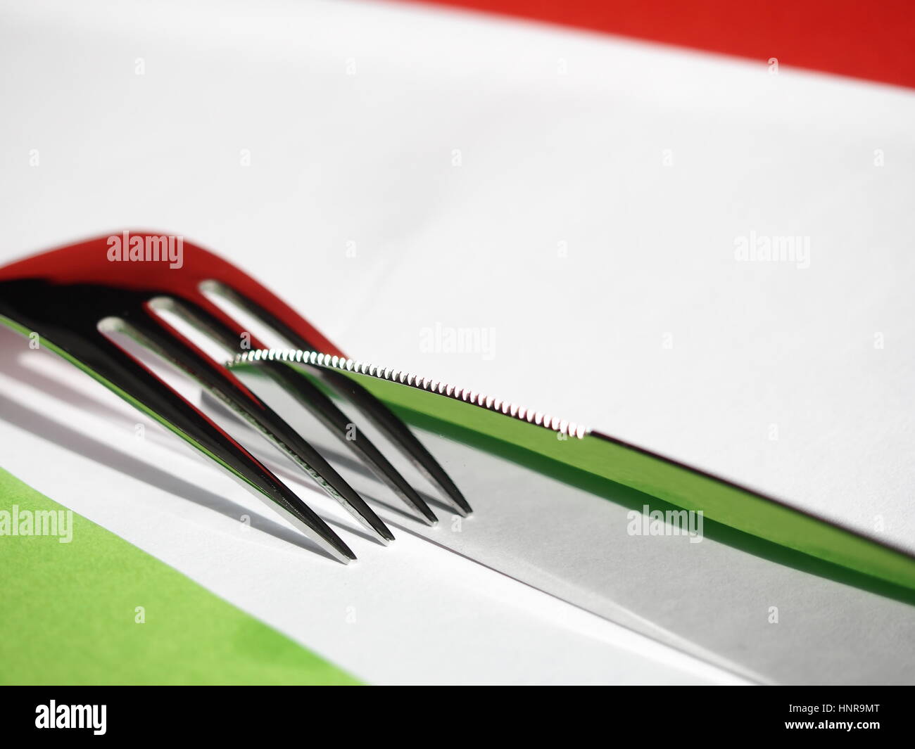 Knife and fork reflection on white background Stock Photo - Alamy