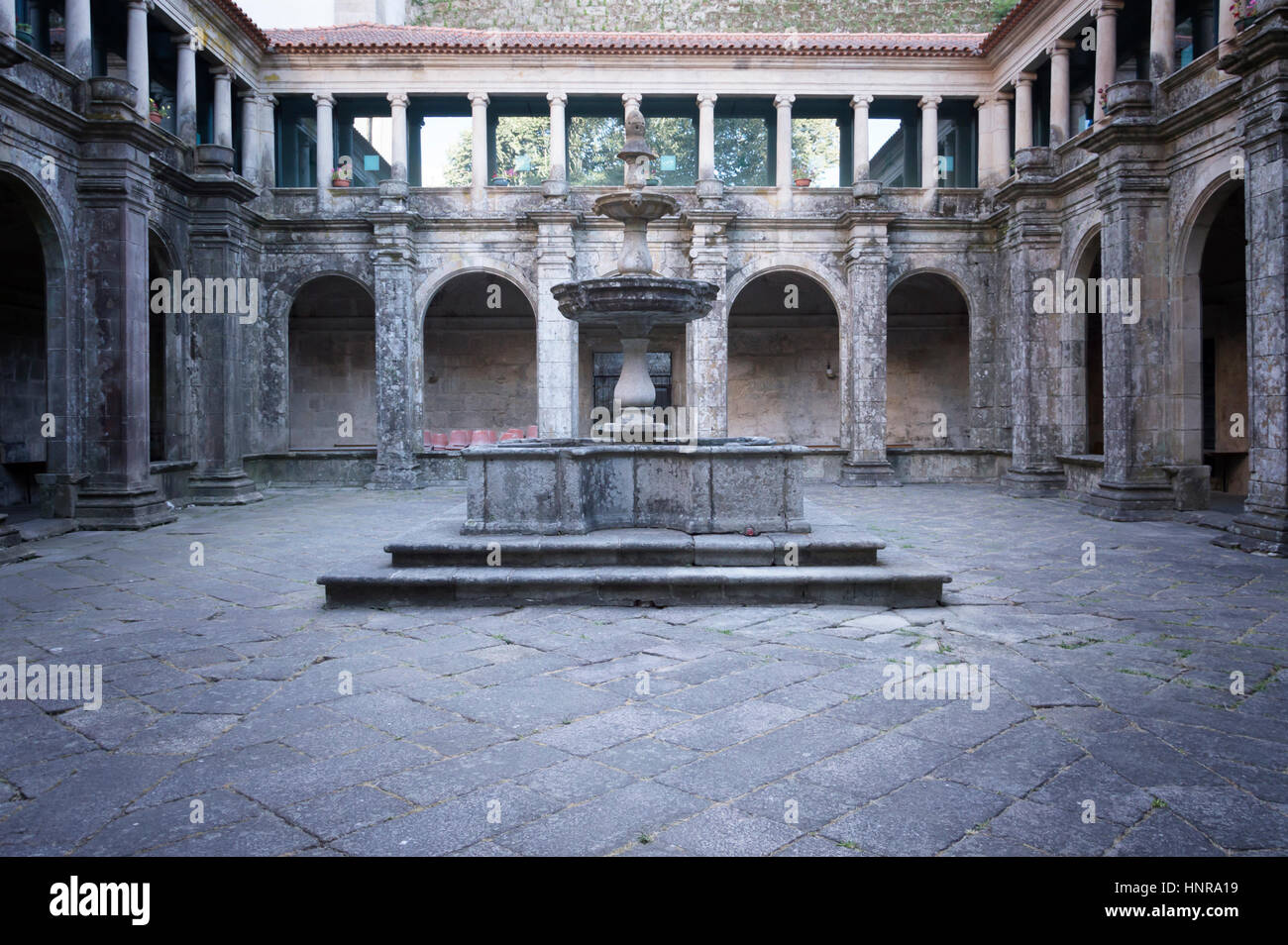 Square with fountain in an old medieval indoor garden dark atmosphere ...