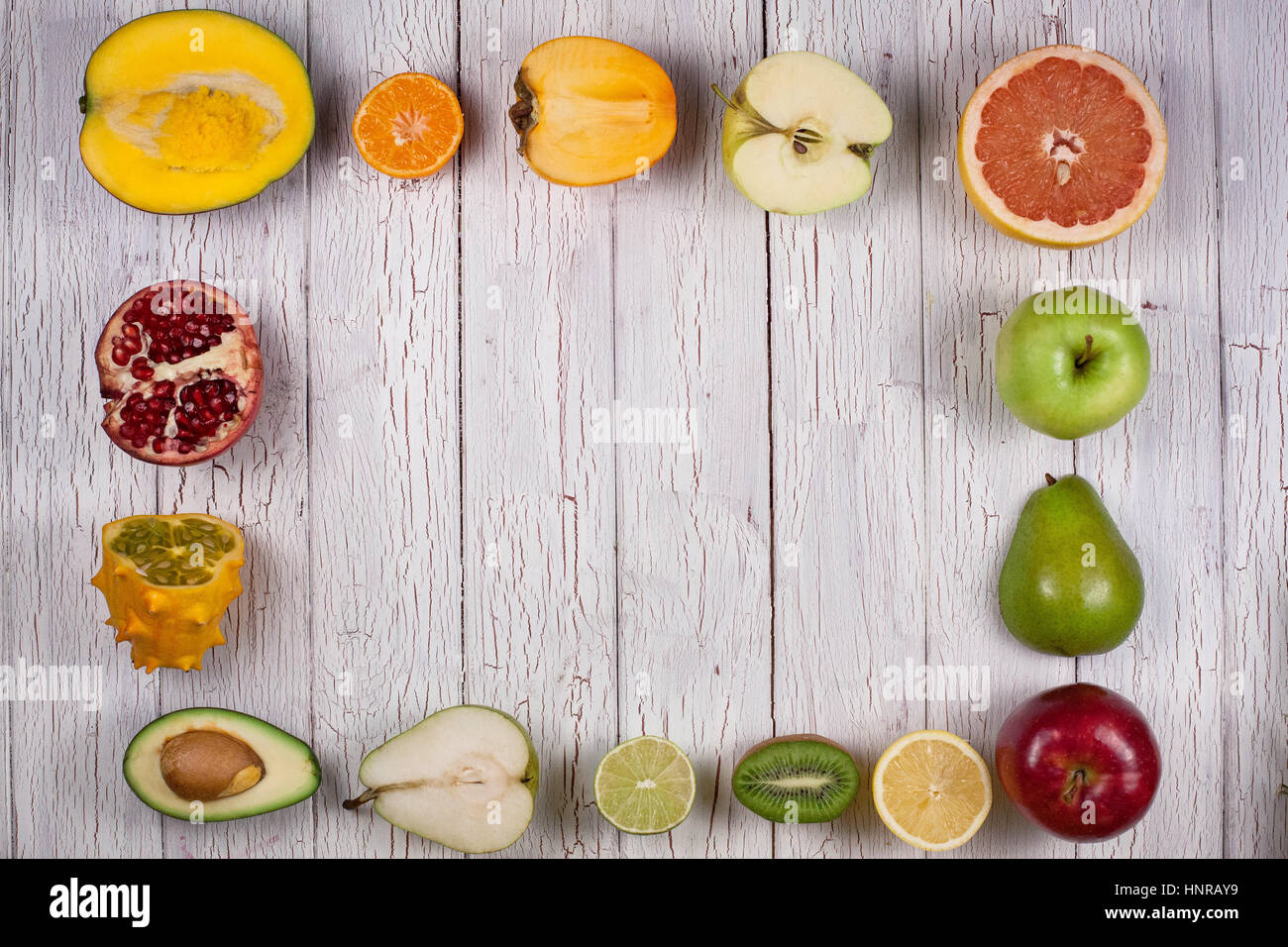 Tropical fruits cut in halves making a shape of square or rectangle ...