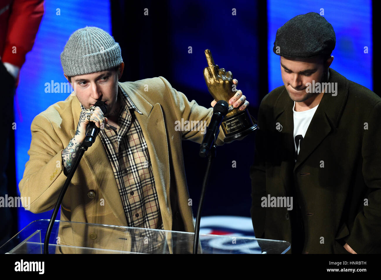 Laurie Vincent (left) and Isaac Holman of Slaves collect the award for ...