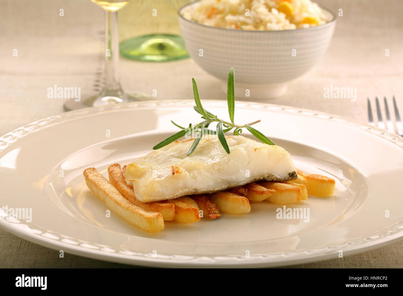 Baked fish and chips on elegant plate Stock Photo - Alamy