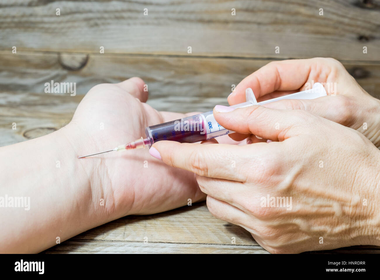 syringe blood collection to improve the patient's health Stock Photo ...