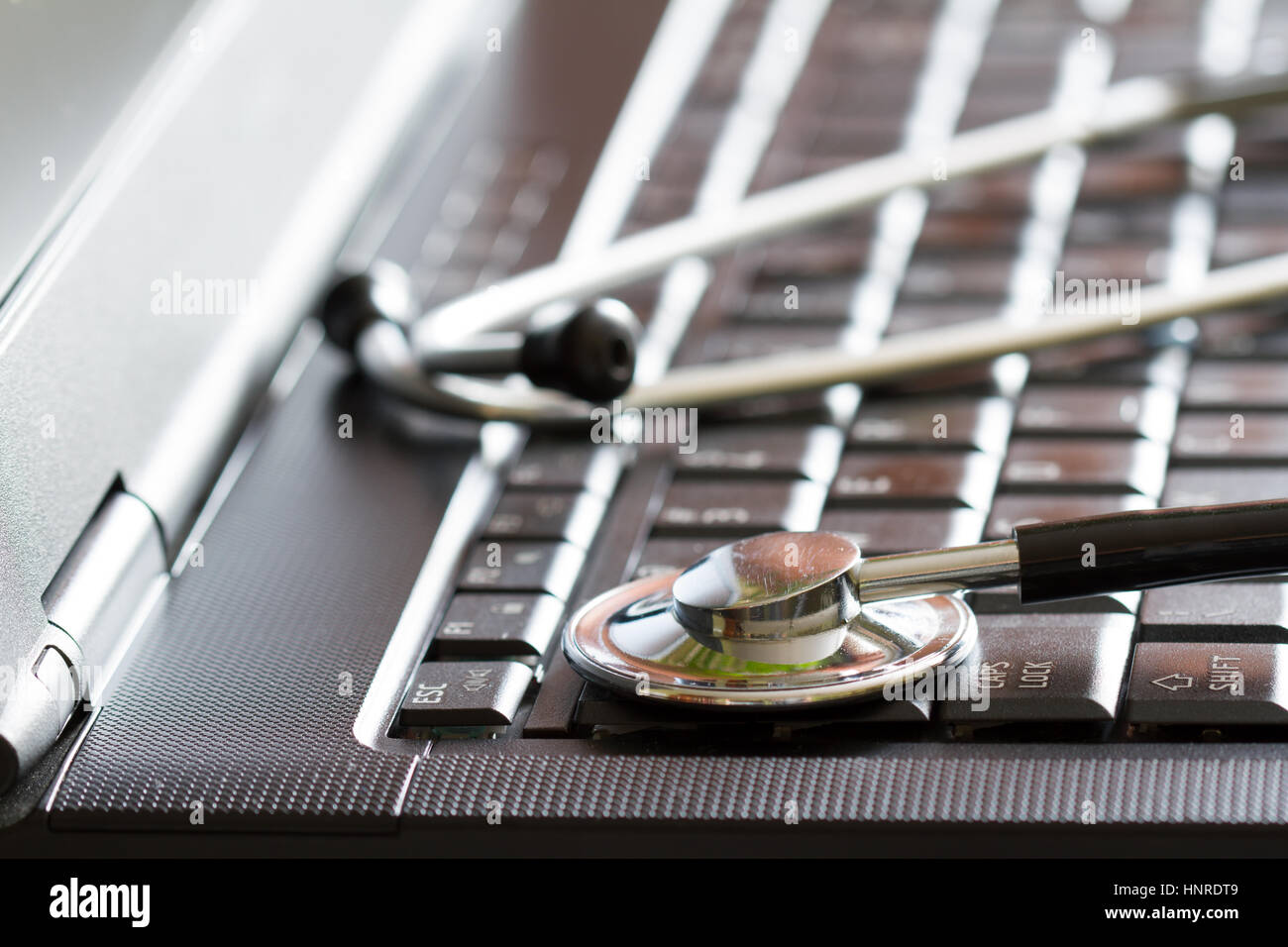 Stethoscope on black laptop computer medical technology concept with ...