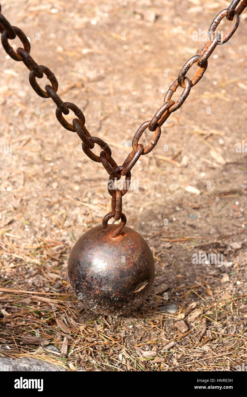 Old counterweight ball and chain still in use on gate Stock Photo - Alamy