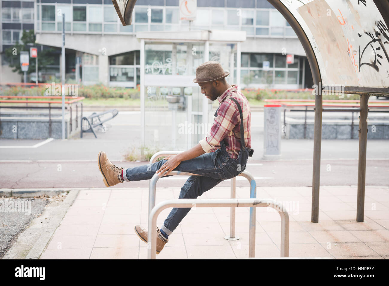 Young handsome afro black man outdoor in the city serious - pensive ...