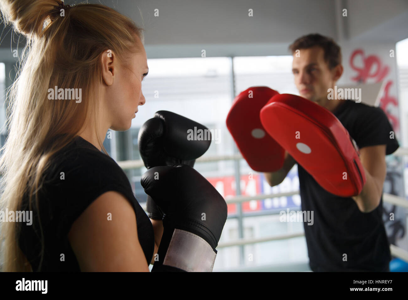 Young couple trains in boxing in gym Stock Photo - Alamy