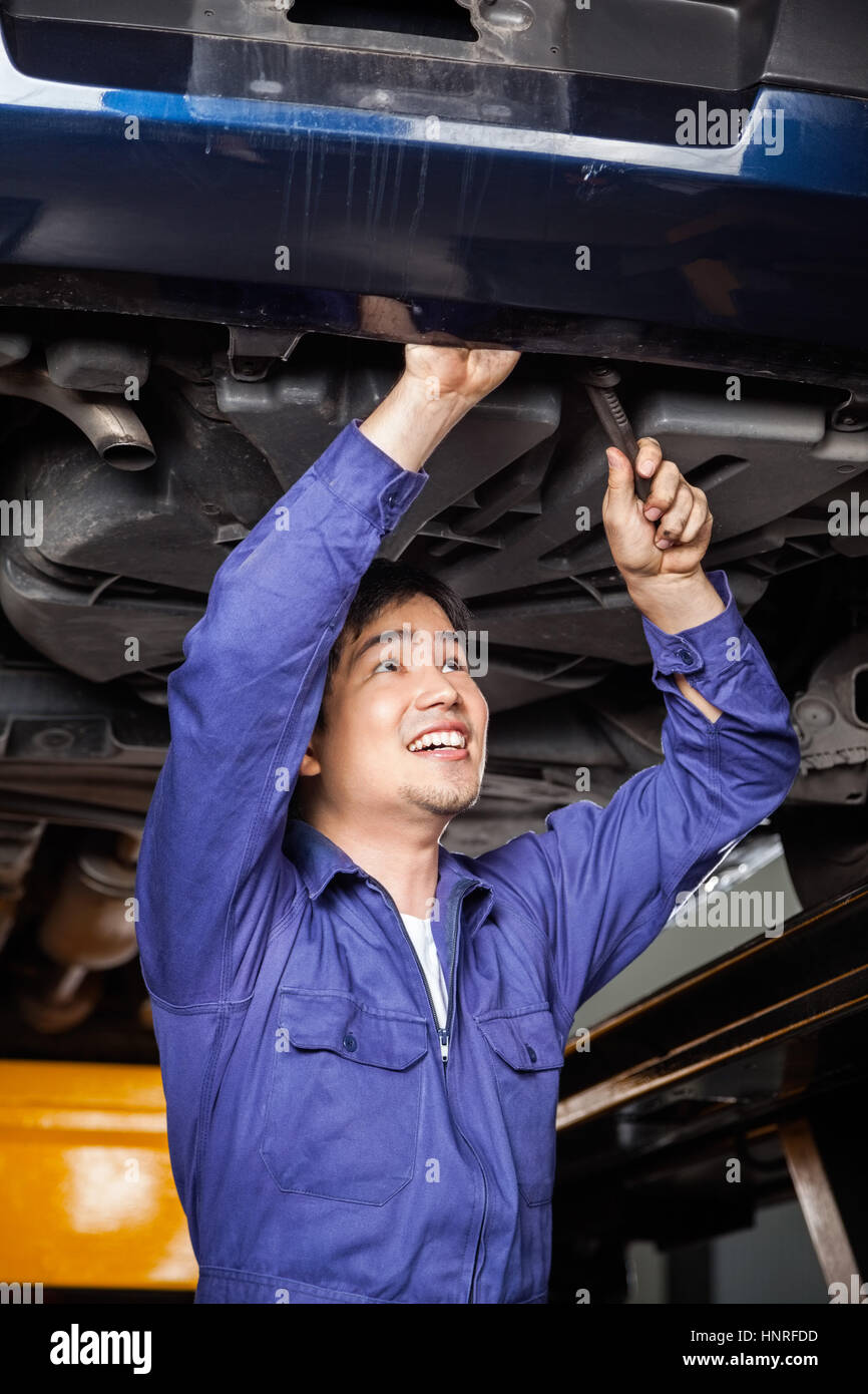 Male employee working repairing hi-res stock photography and images - Alamy