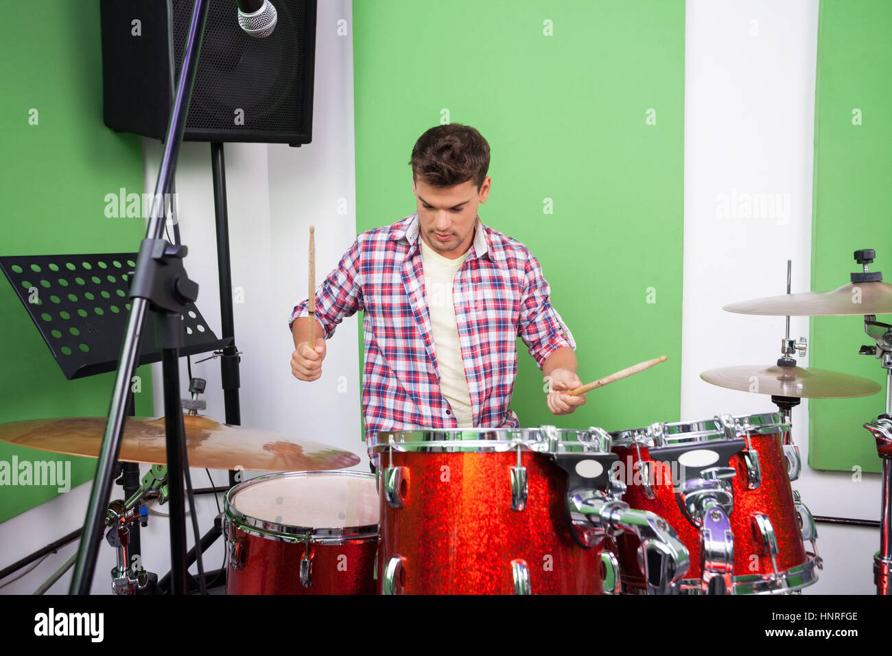 Professional Playing Drums In Recording Studio Stock Photo - Alamy