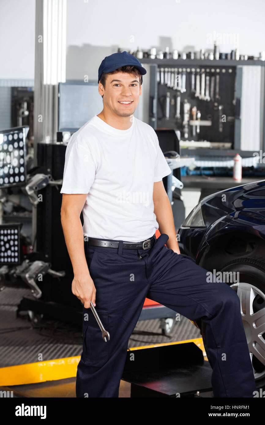 Smiling Male Mechanic In Garage Stock Photo - Alamy