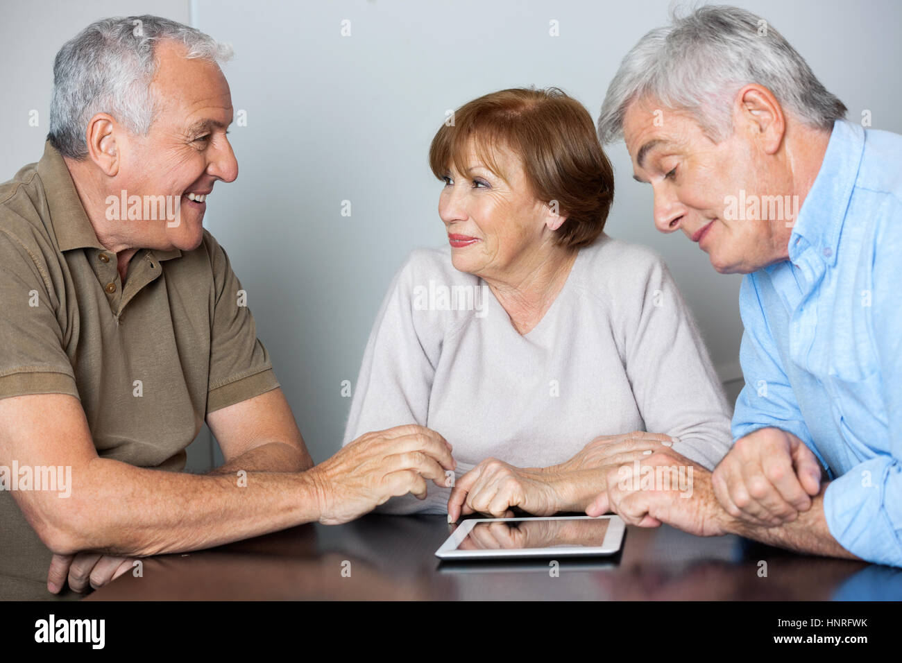 Senior Classmates Using Digital Tablet In Computer Class Stock Photo ...