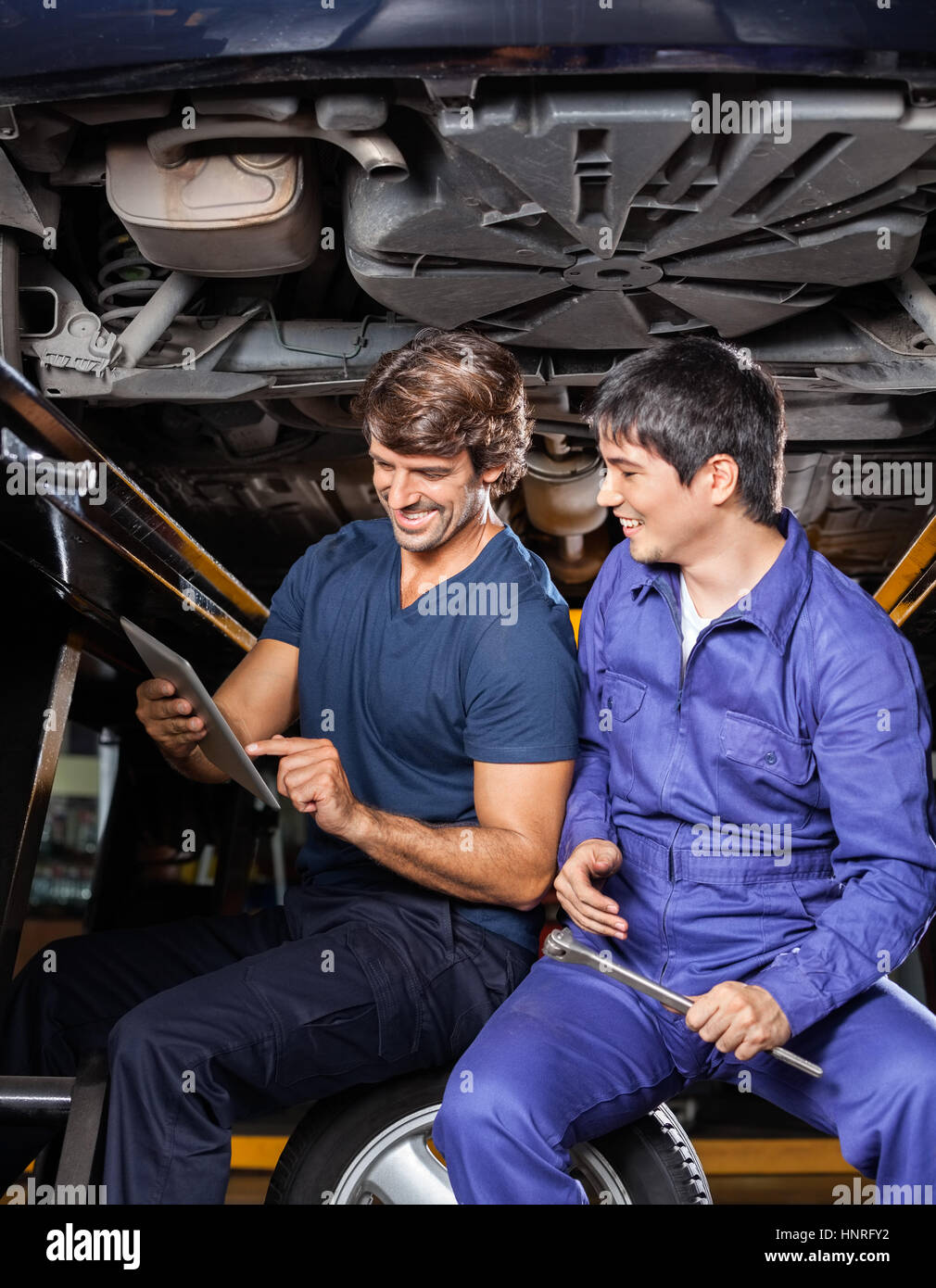 Car lift under hi-res stock photography and images - Alamy