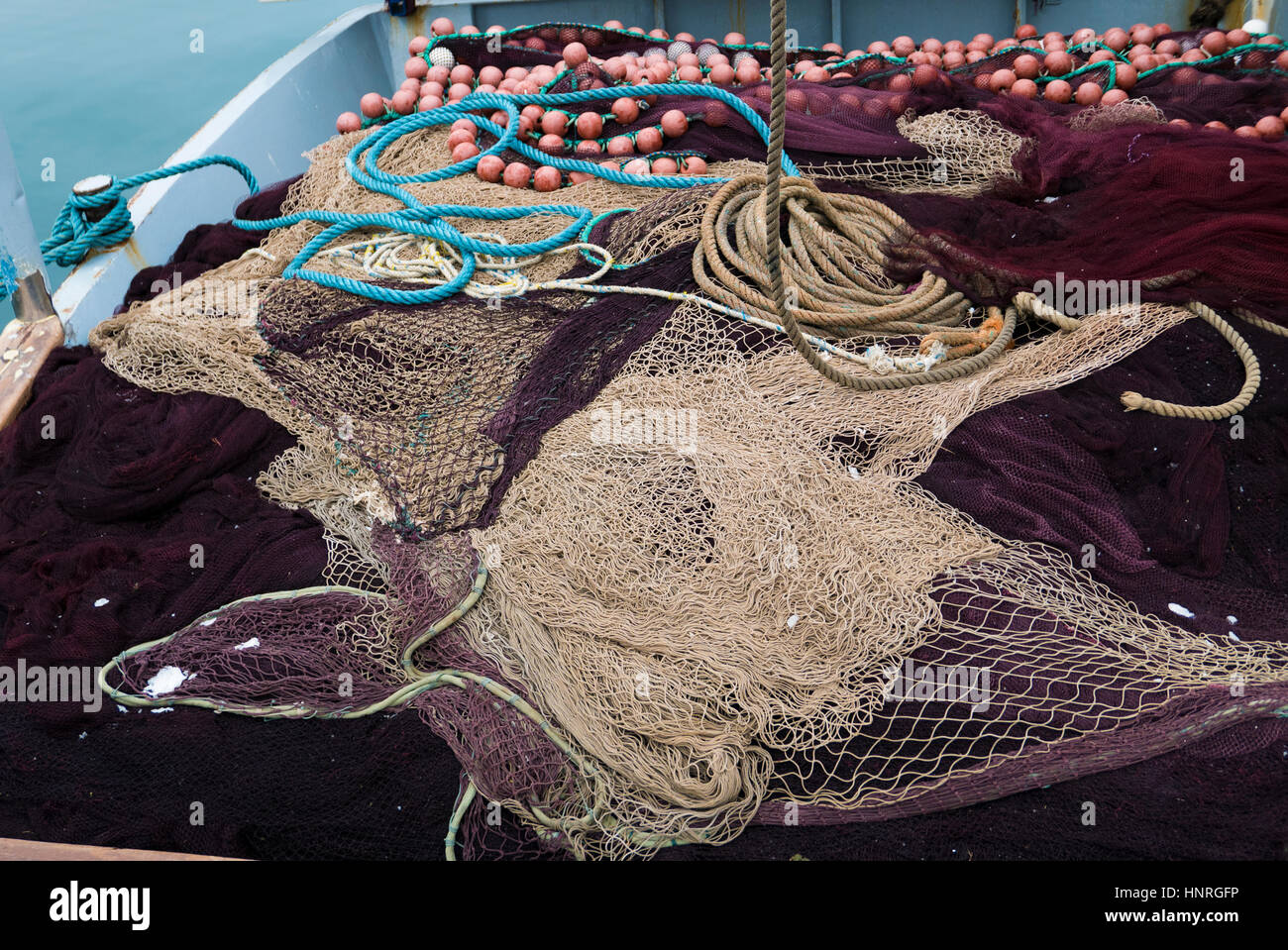 Fishing nets in a boat on the Greek coast, creating beautiful patterns ...