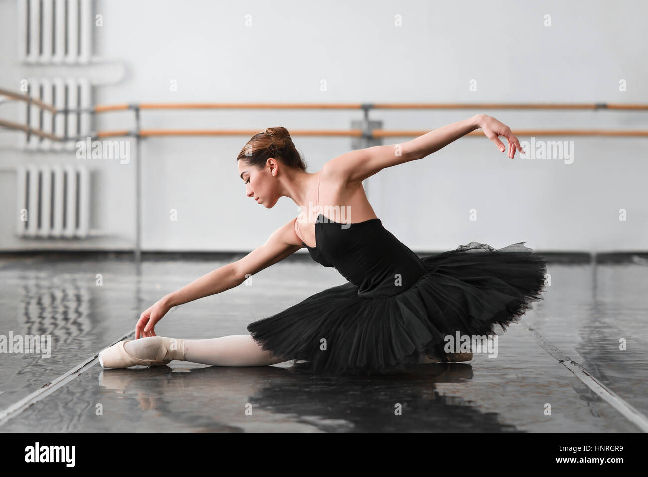 Female ballet dancer posing on rehearsal in class. Ballerina dance ...