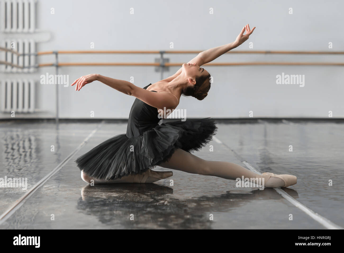 Female ballet dancer posing on rehearsal in class. Ballerina dance ...
