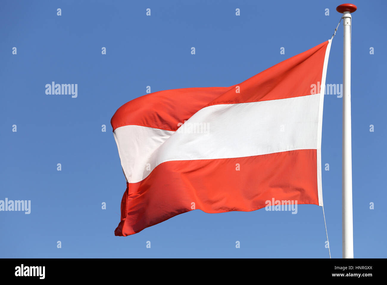 Austrian flag flying in the wind Stock Photo - Alamy