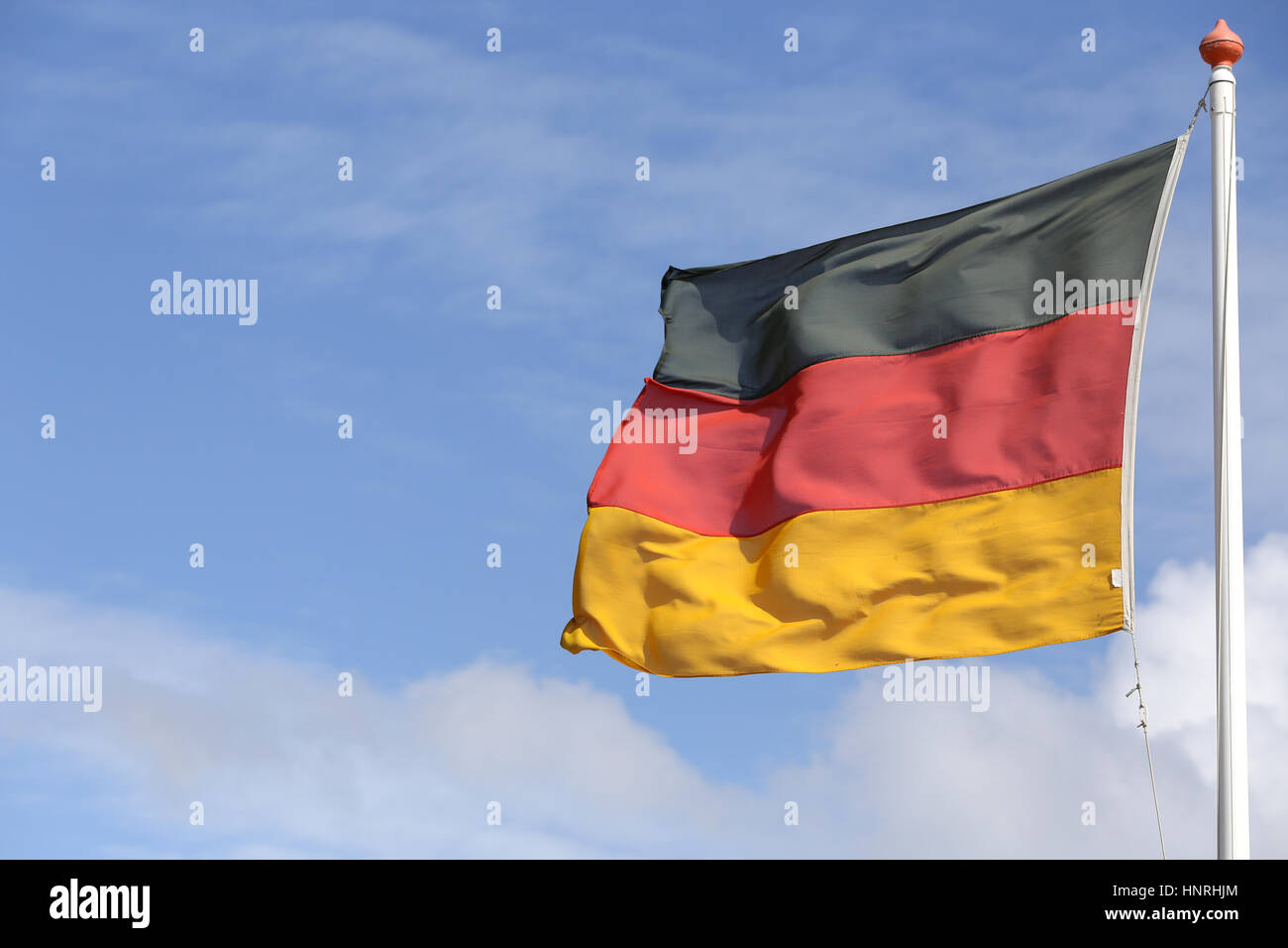 German flag flying in the wind Stock Photo - Alamy