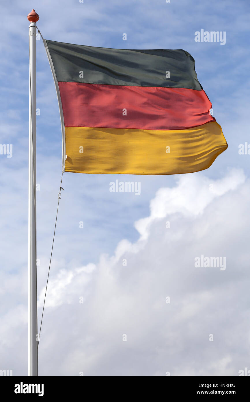 German flag flying in the wind Stock Photo - Alamy