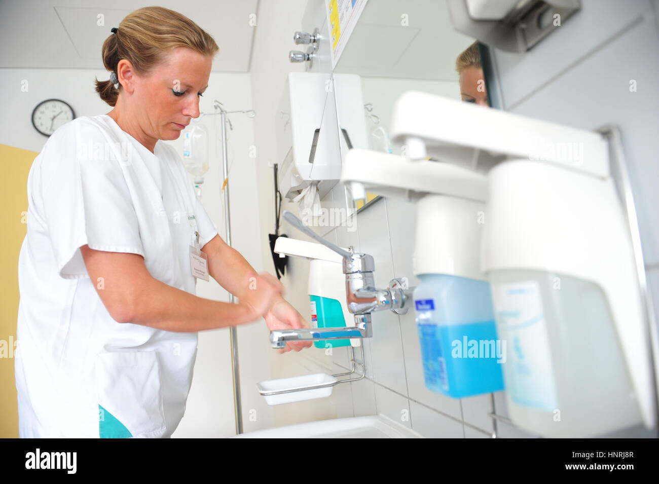 Frankfurt, Germany - September 17, 2009 - Doctor washing hands in ...