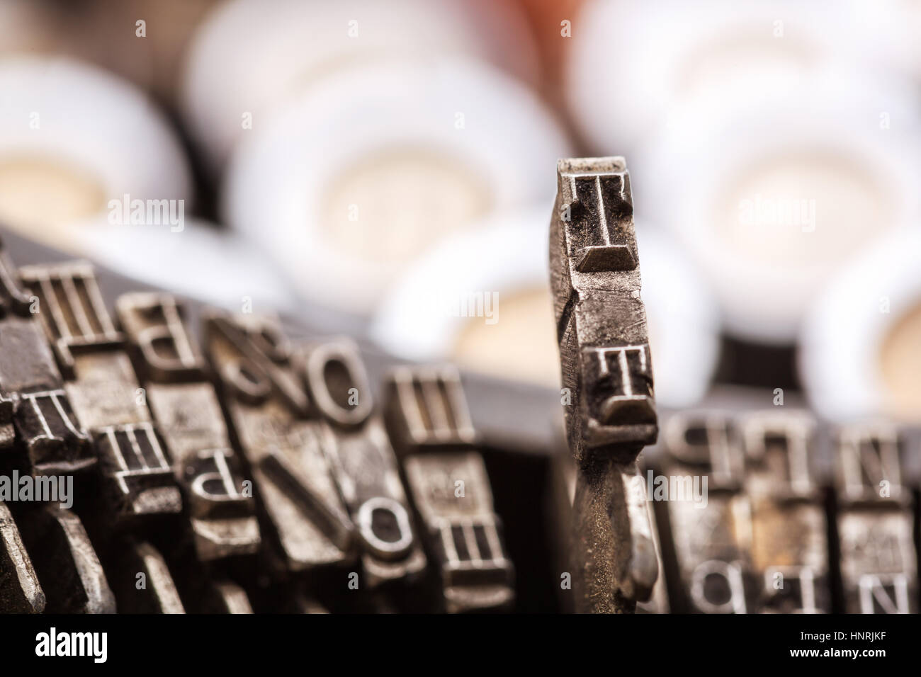 Retro writing machine type bars closeup. Vintage typewriter letters ...