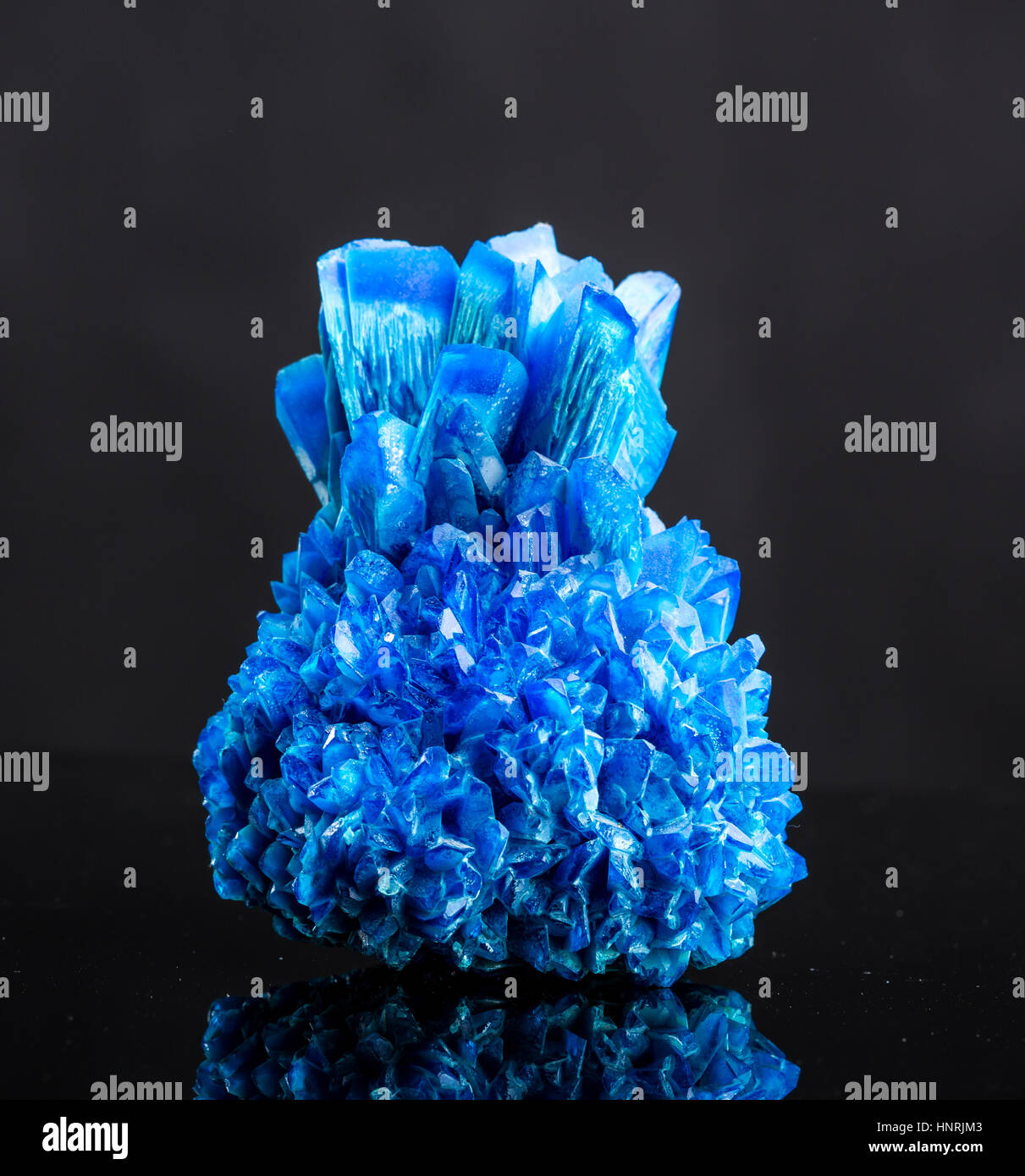 Blue salt crystal isolated on black background. Icy sulphate Stock ...