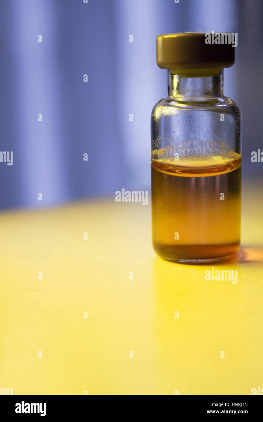 Transparent vial with liquid medicine Stock Photo - Alamy