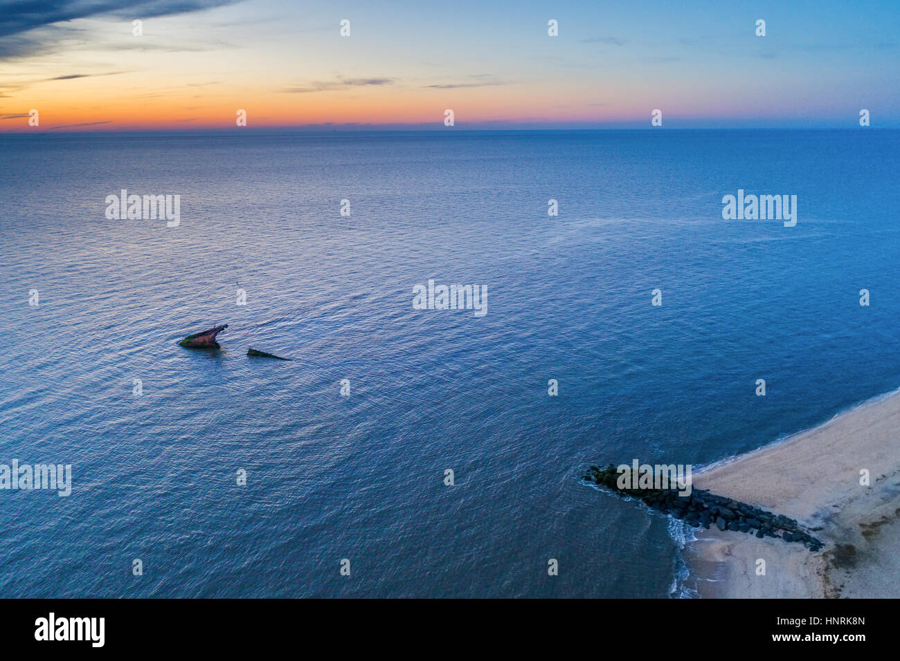 Sunset over the Delaware Bay and SS Atlantus Shipwreck at sunset, at ...