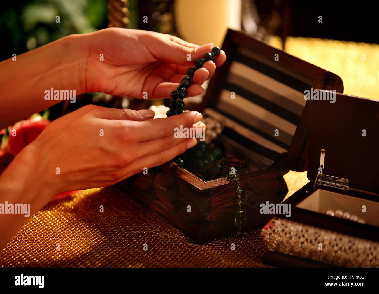 Jewellery box with female hands touch jewelry decorations Stock Photo ...