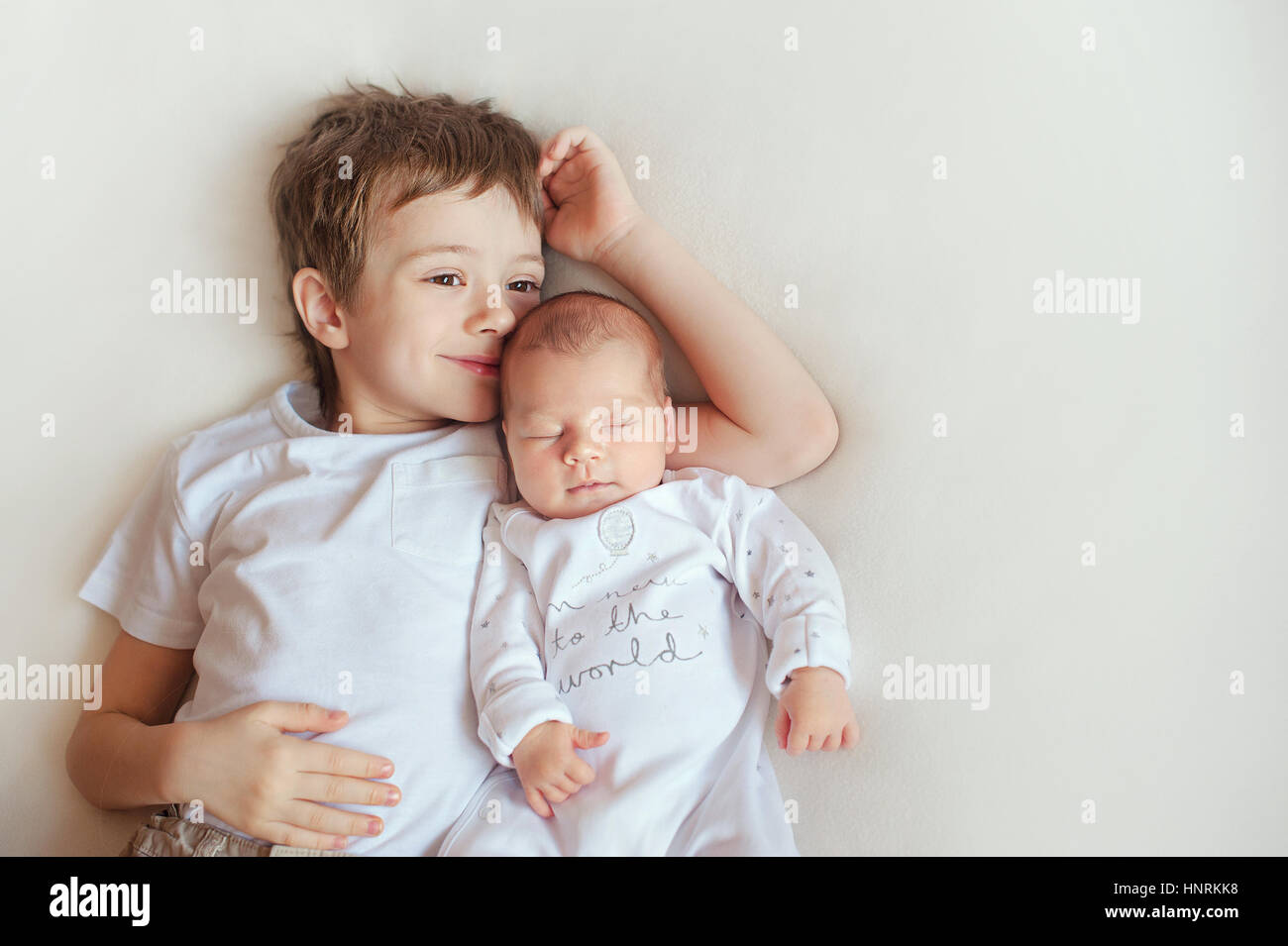 Cute Baby Boy And Girl Hugging