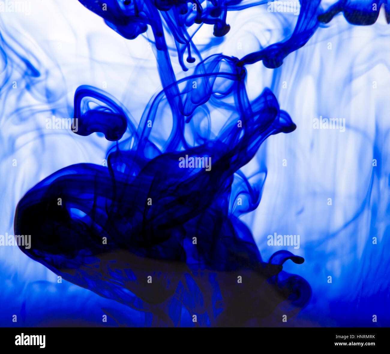 Abstract image of ink flowing in water to make an interesting and ...