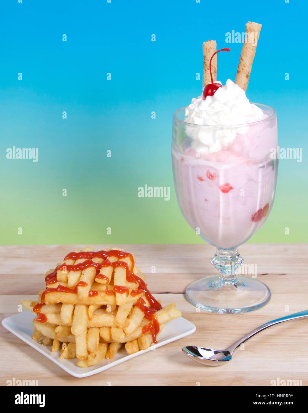 Sweet and Salty. French fries stacked criss crossed on a square plate ...