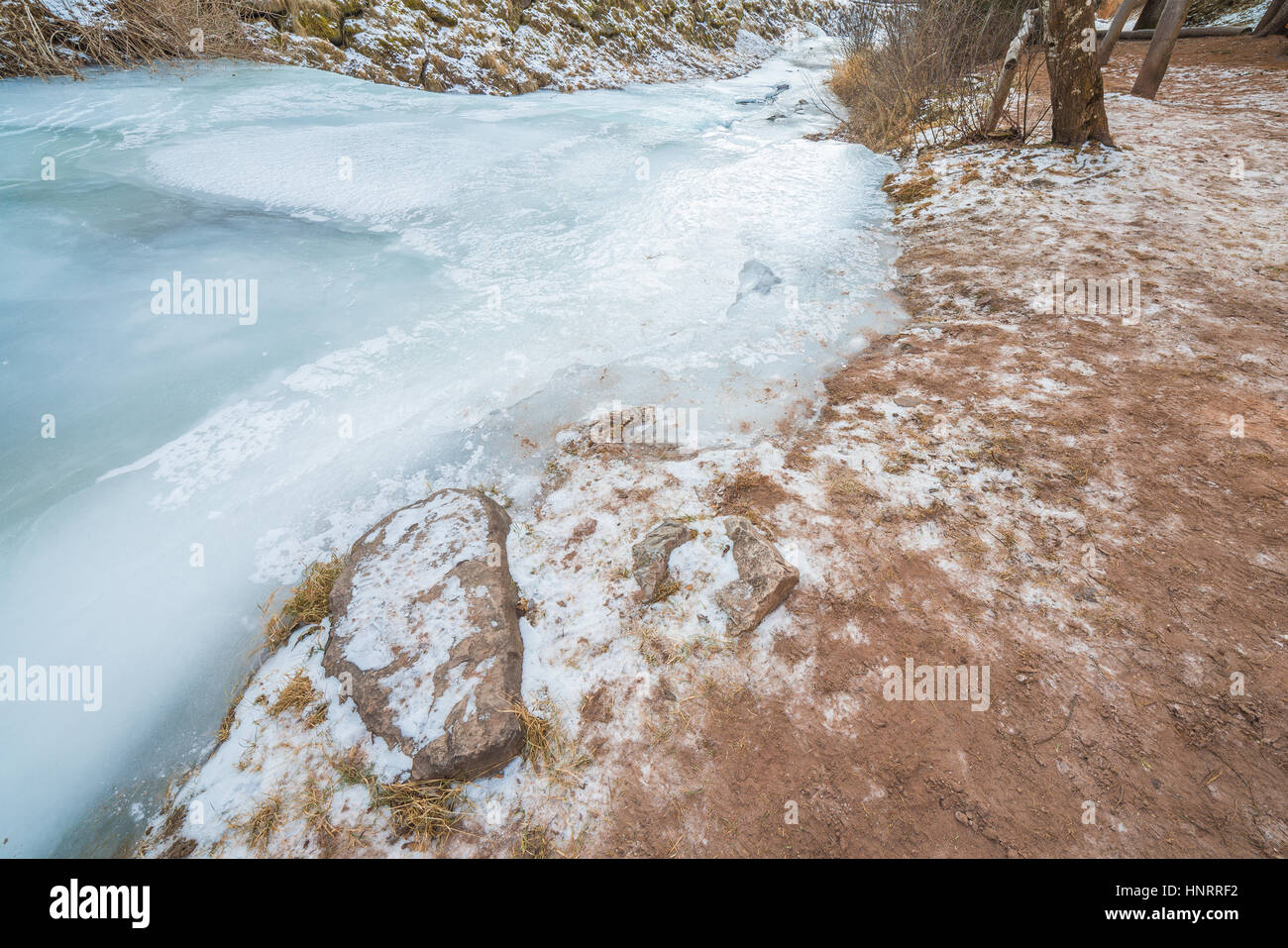 frozen brook in the forest in the mountains Stock Photo - Alamy