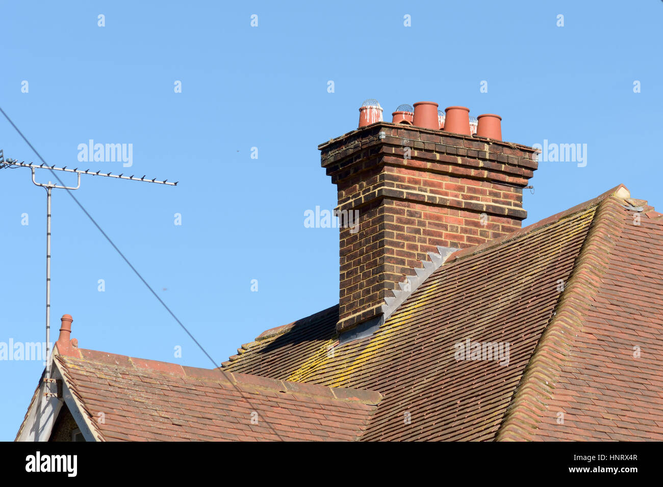 Chimney stack on roof of house Stock Photo - Alamy
