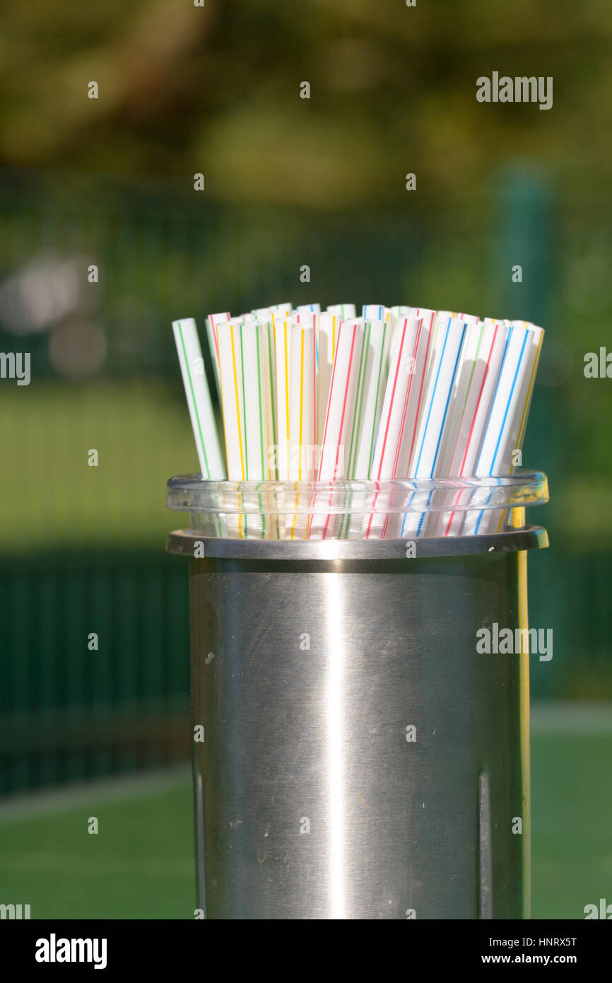 Plastic drinking Straws in container at cafe Stock Photo - Alamy