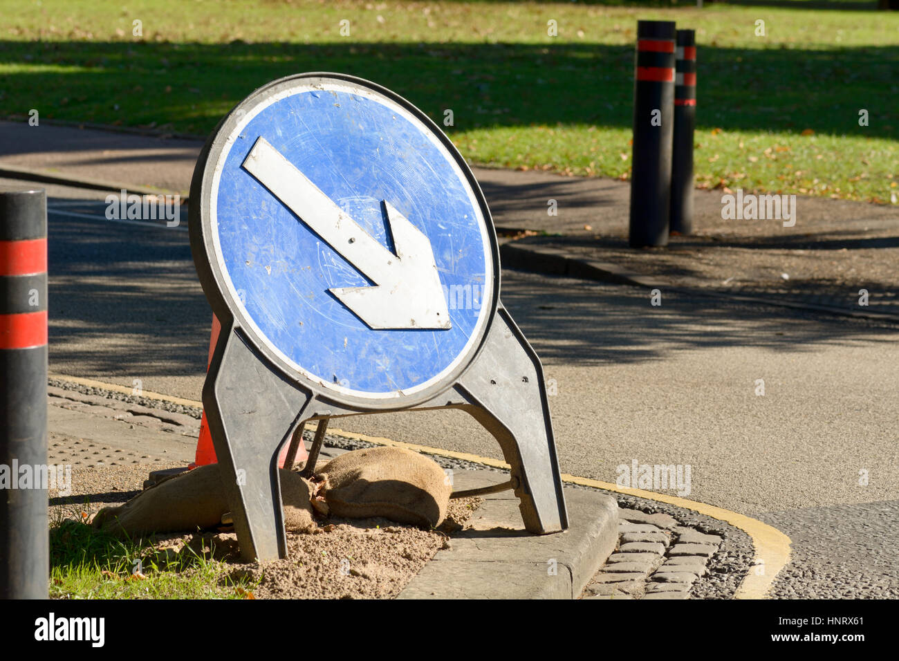 Blue traffic sign white arrow hi-res stock photography and images - Alamy