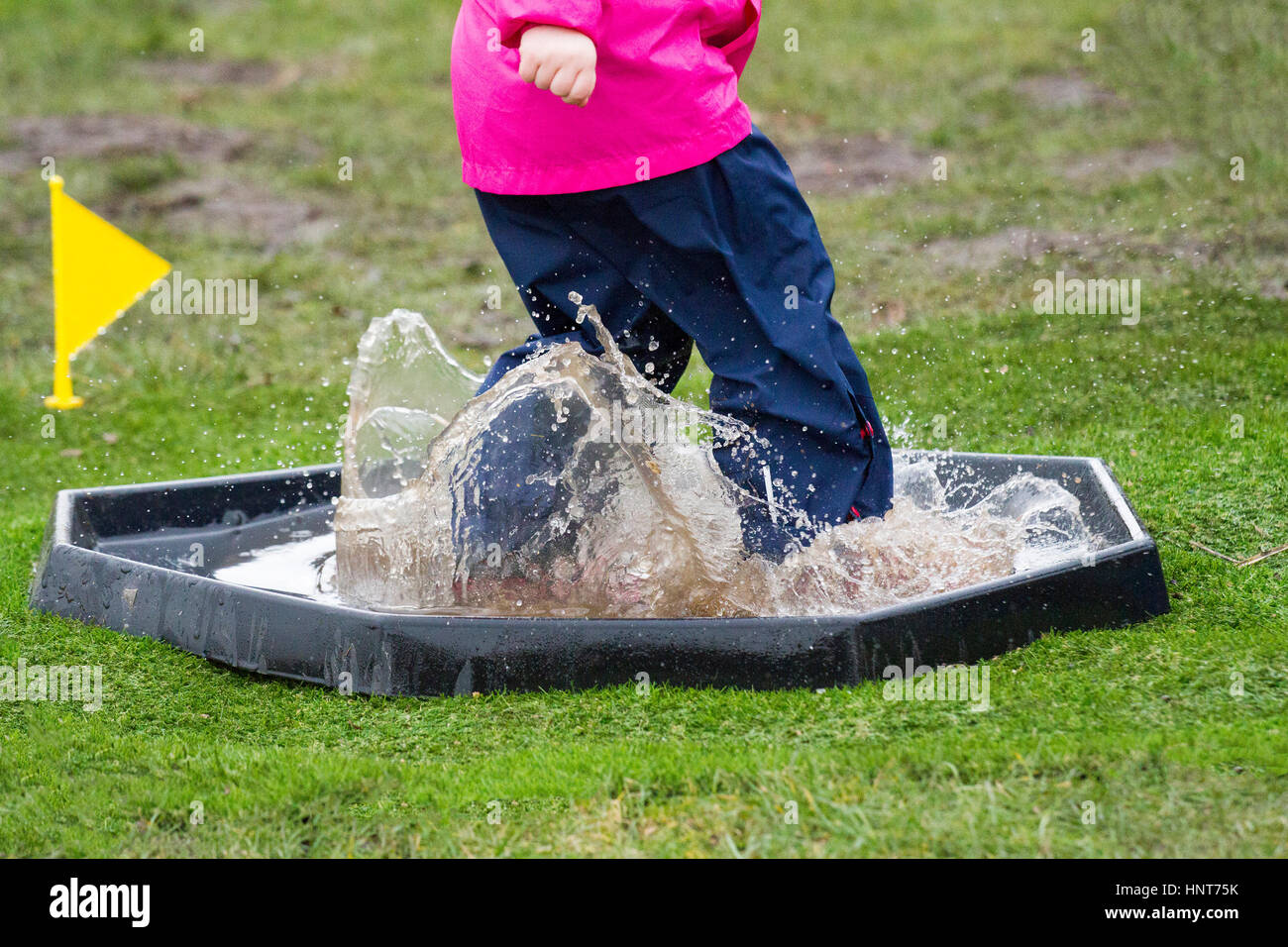 Child Splash Puddles Boots Stock Photos & Child Splash Puddles Boots ...